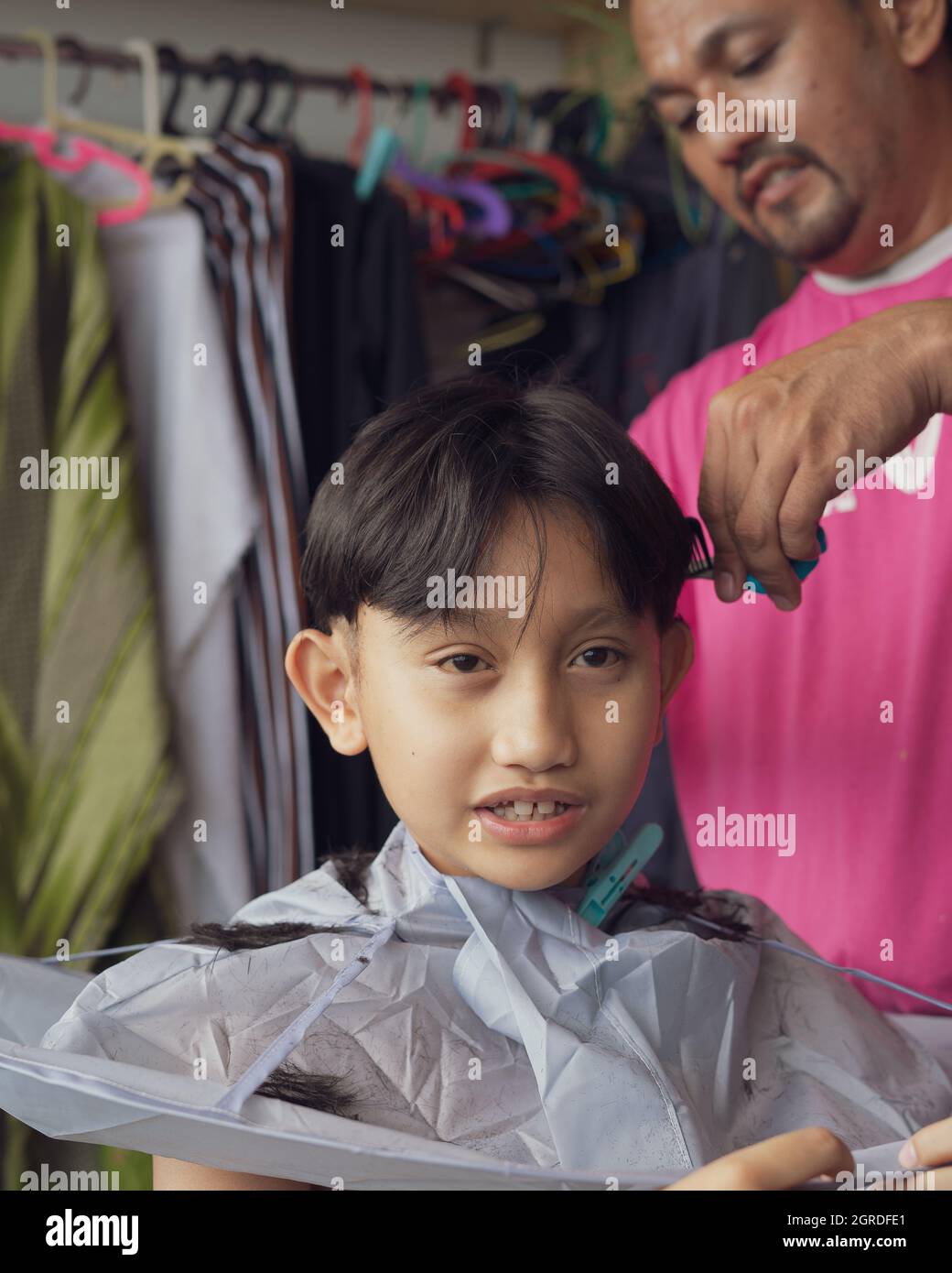 Boy haircut barber father hi-res stock photography and images - Alamy