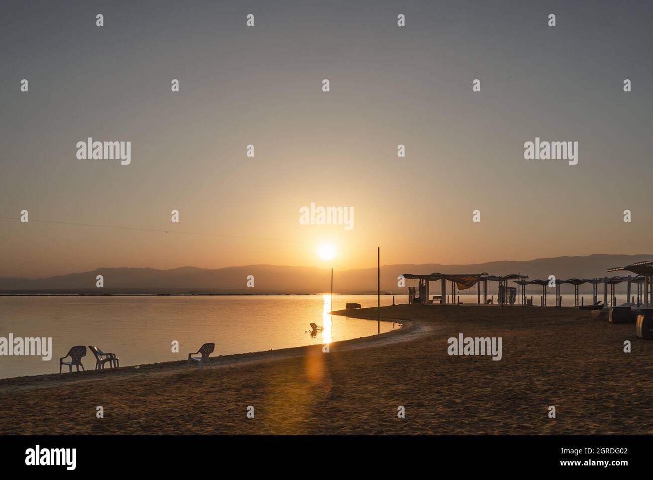sunrise on the Dead Sea overlooking the beach and water Stock Photo - Alamy