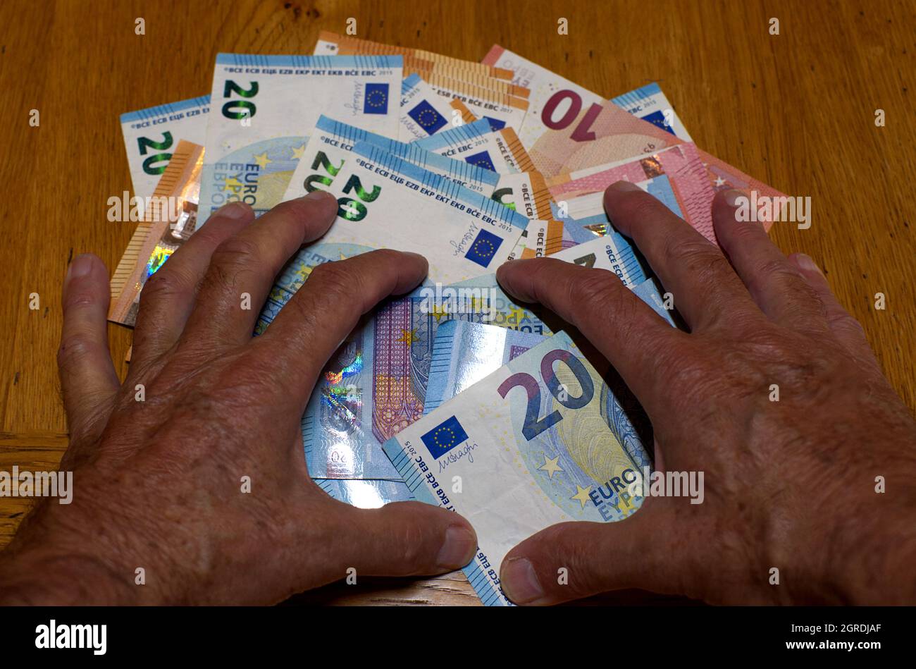 Money grabbing hi-res stock photography and images - Alamy