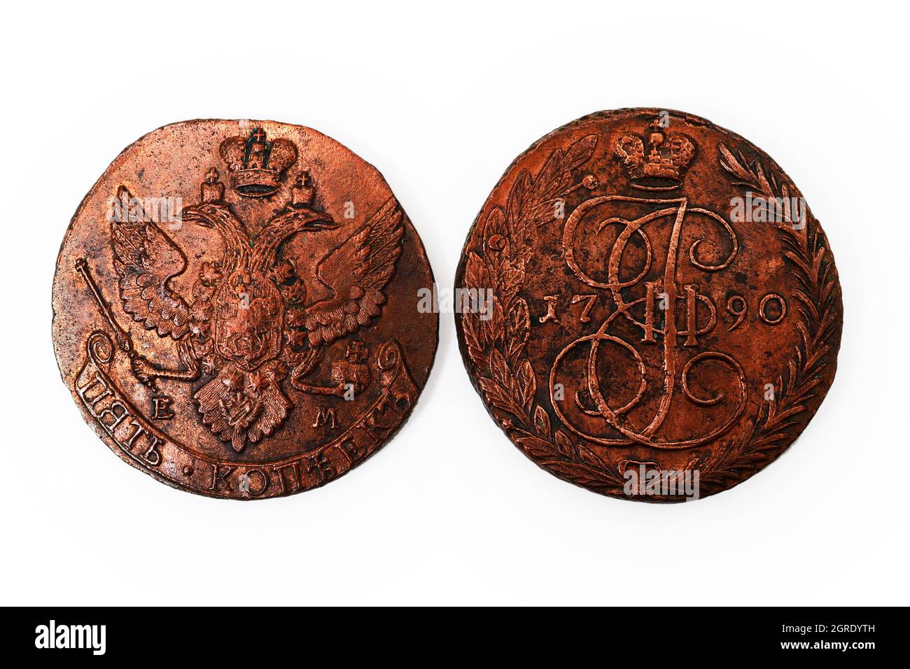 two old Russian copper coins of the 18th century on white background ...
