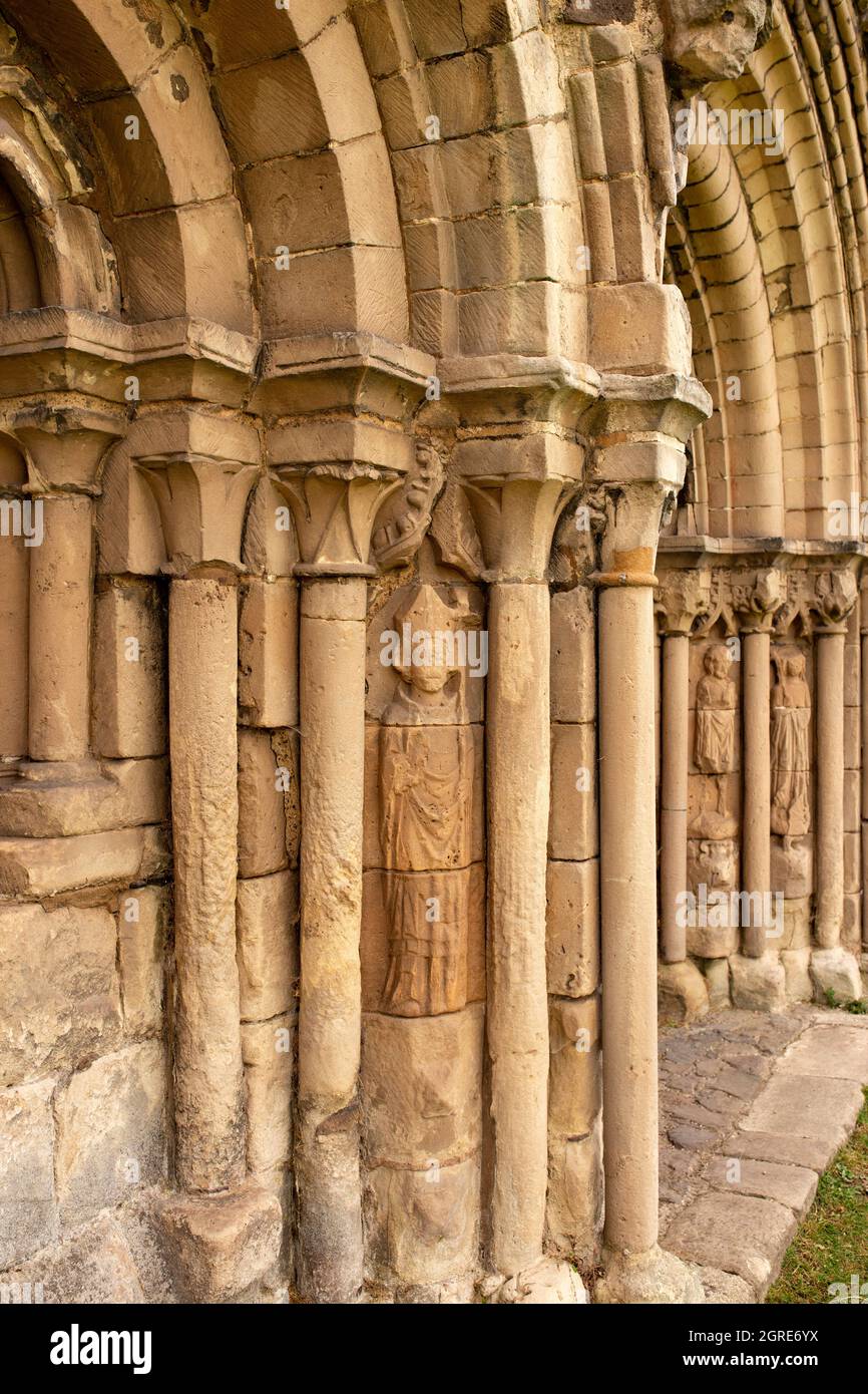 Stone columns and figures carved on a medieval abbey ruin. Medieval ...