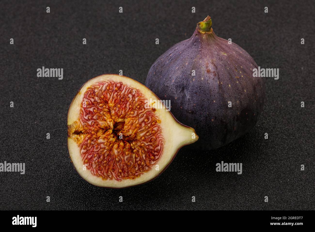 Sweet purple slice of fig fruit Stock Photo - Alamy