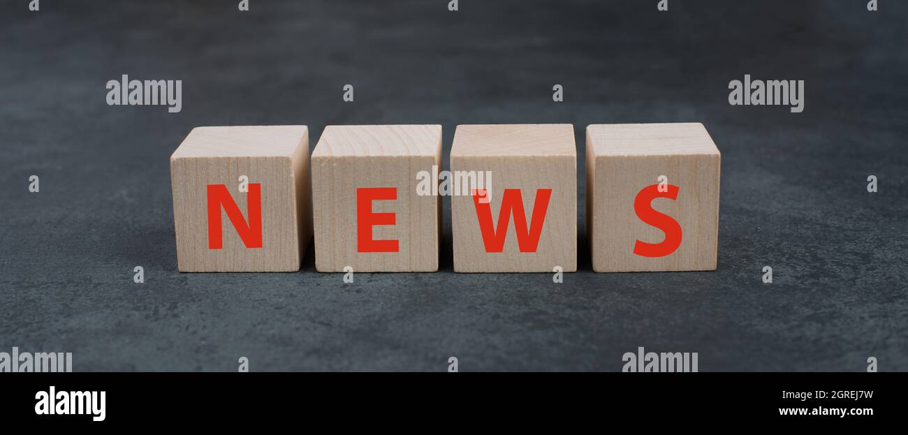 The word news is standing on wooden blocks, red color Stock Photo - Alamy