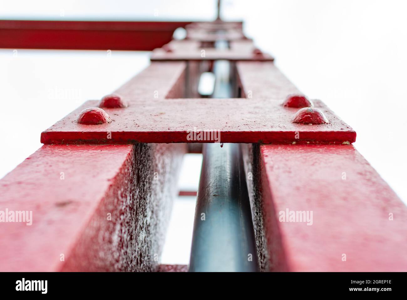 Column, riveted steel frame, painted red Stock Photo - Alamy