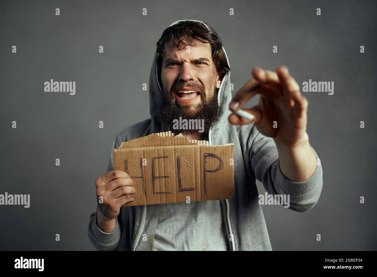 poor tramp holding a sign Help emotion loneliness on the street Stock ...