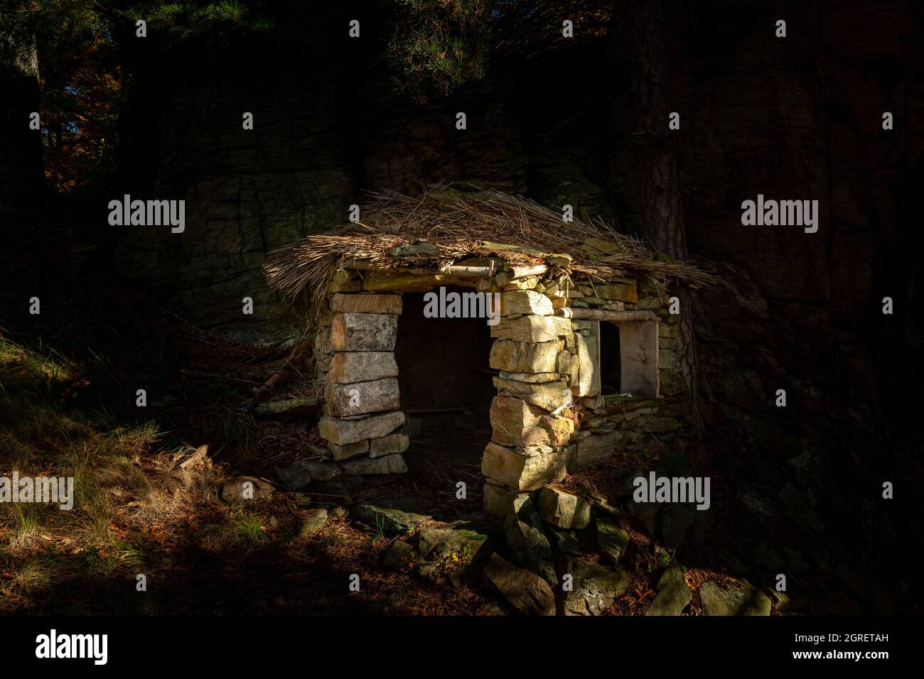 Small stone hut in the middle of a forest, sunny day in autumn Stock ...