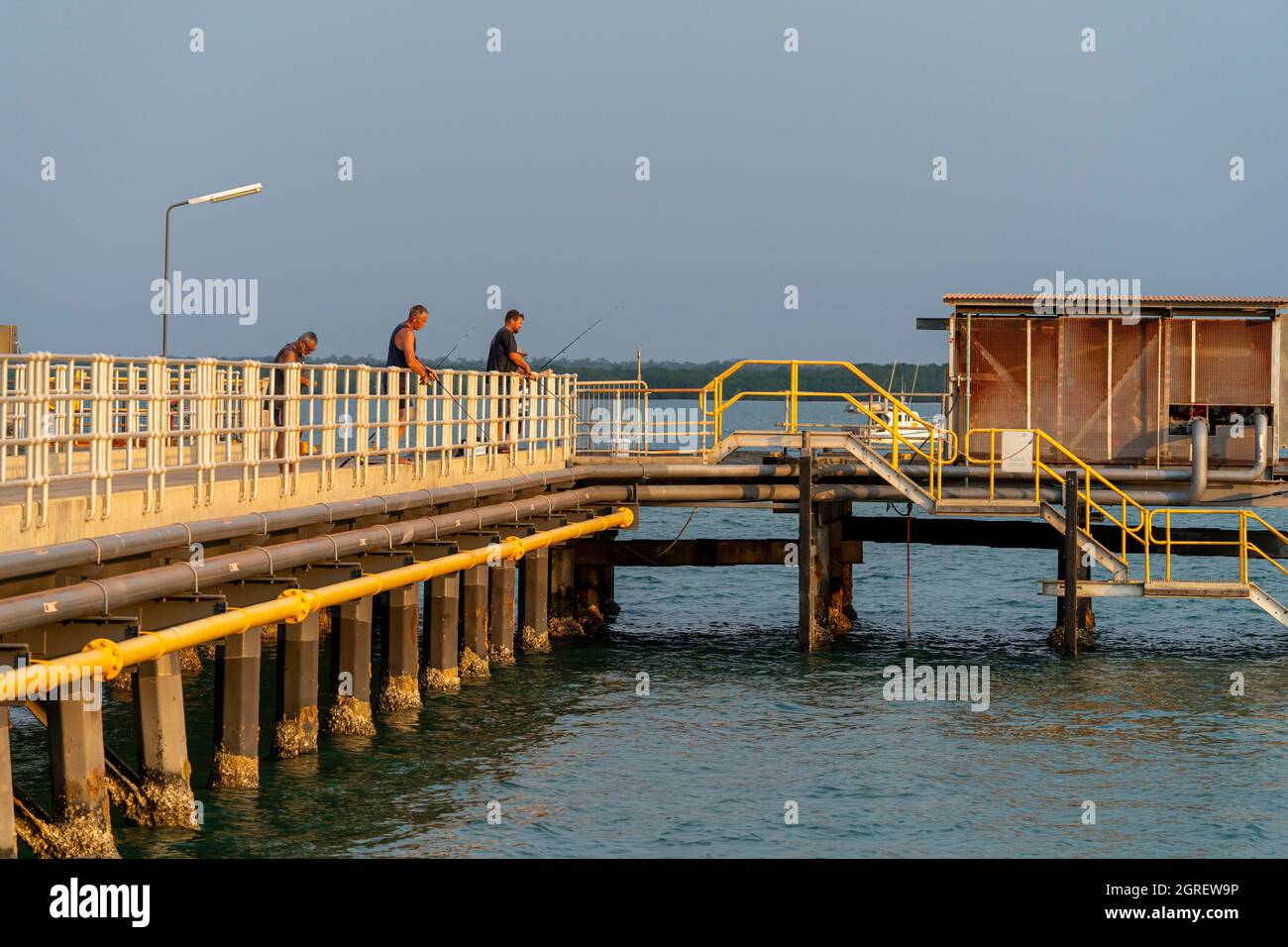 3 people fishing on Evan's Head refueling jetty, Weipa, Cape York ...
