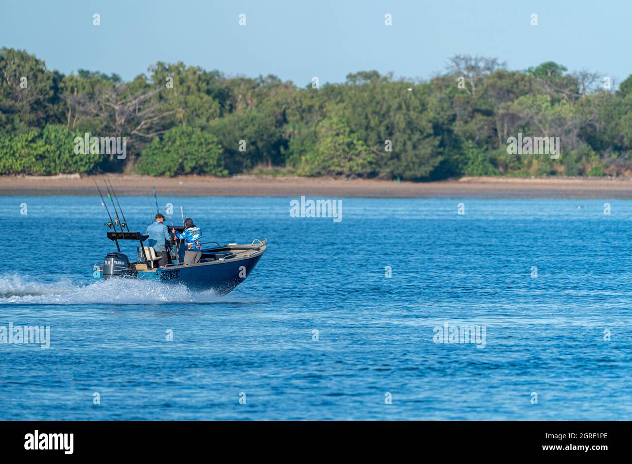 Two fishermen in aluminum boat setting out of Port of Weipa. Cape York ...