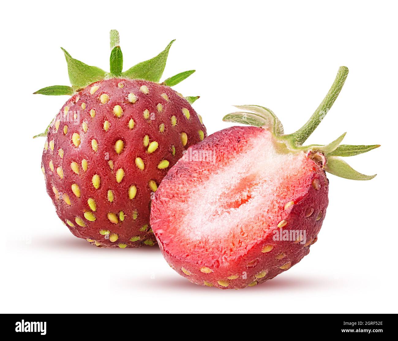 Wiild strawberry and one cut in half isolated on white background ...
