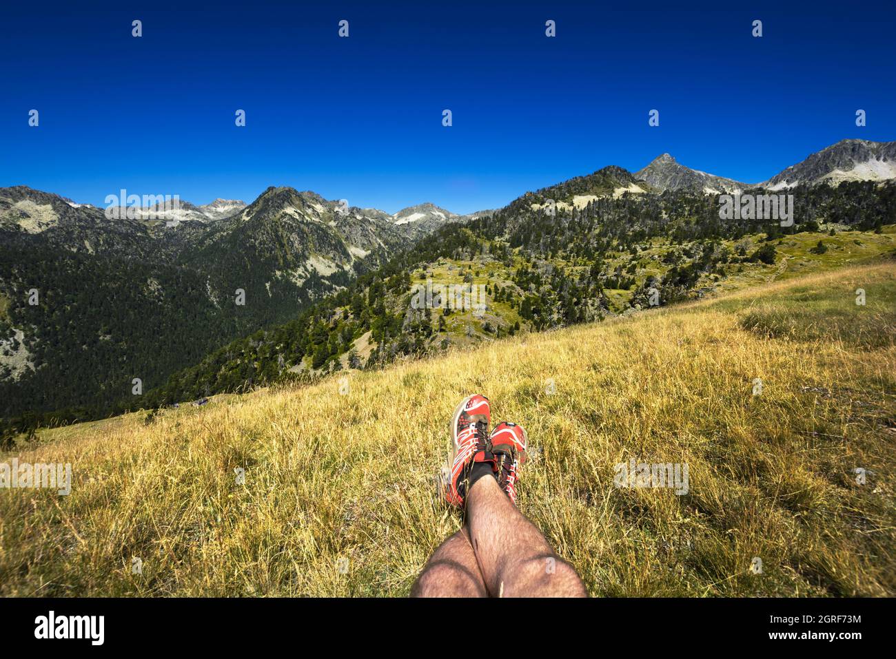 Landscape and legs during mountain hiking at Pyrenean mountain Stock ...