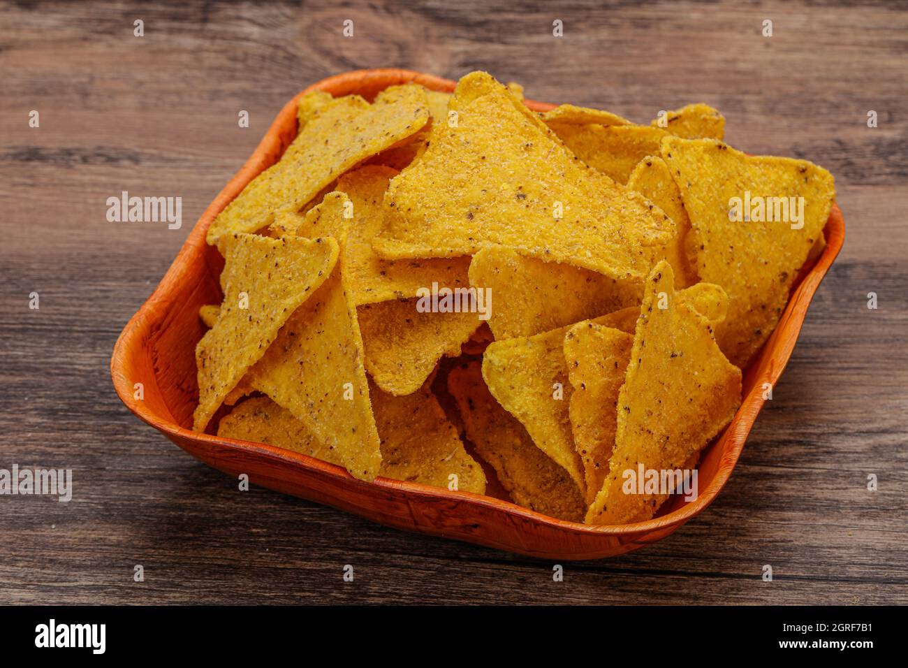 Mexican crunchy corn nachos triangle heap Stock Photo - Alamy