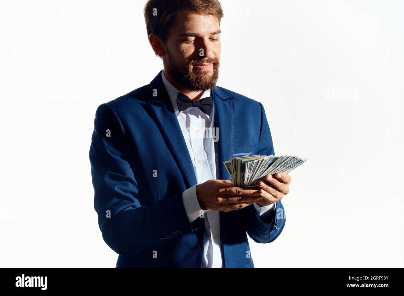 rich man investments economy light background Stock Photo - Alamy