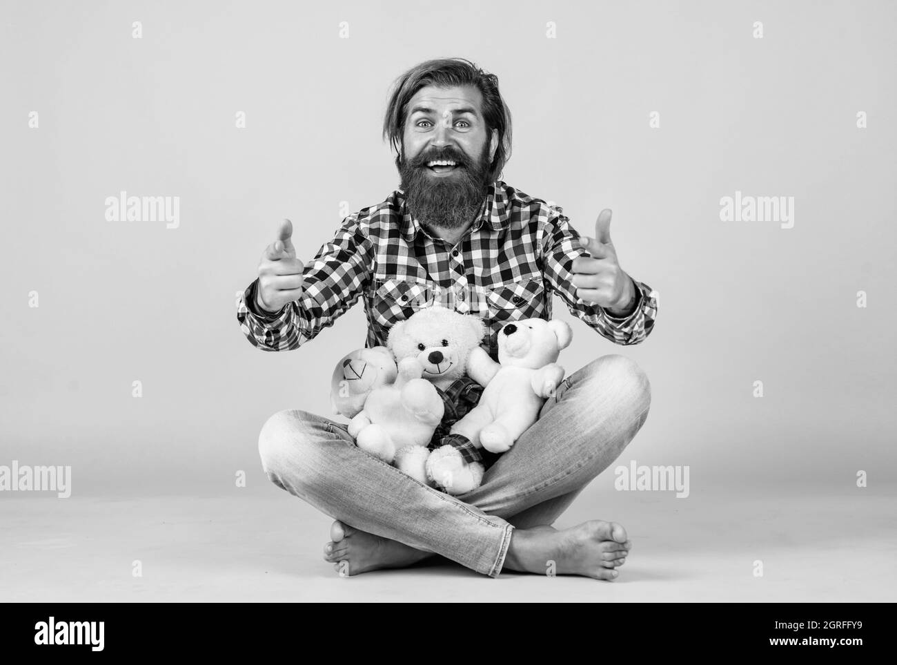 Happy bearded man holds Black and White Stock Photos & Images - Alamy