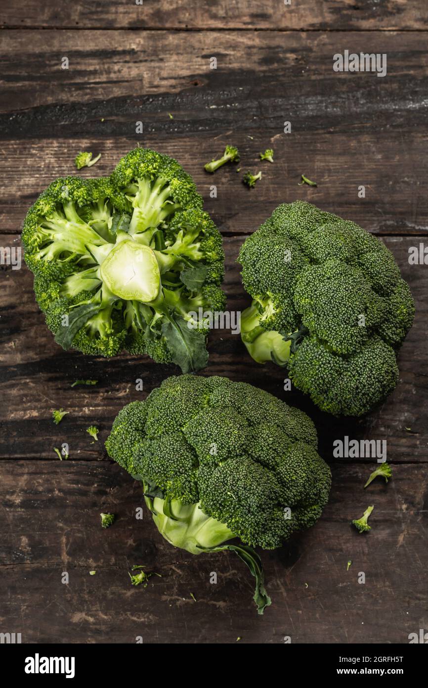 Green fresh broccoli on old wooden background. Ripe vegetables for diet ...