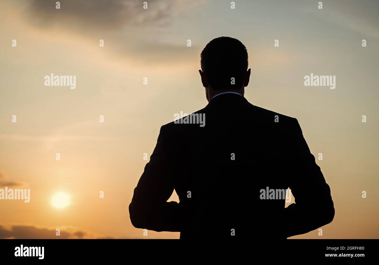 silhouette of man looking far on sunrise sky, future Stock Photo - Alamy