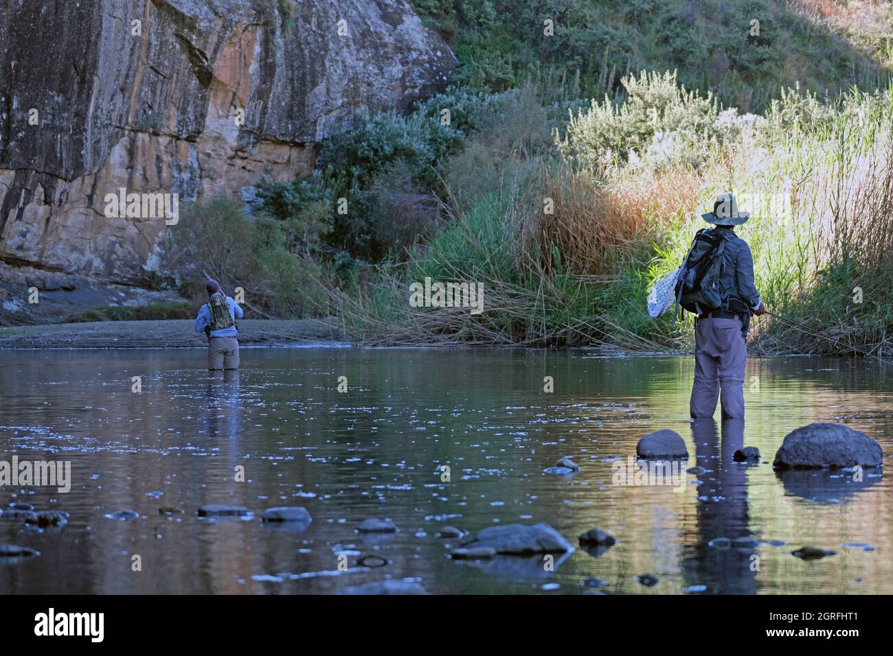 Fishermen catching fish in the river Stock Photo - Alamy