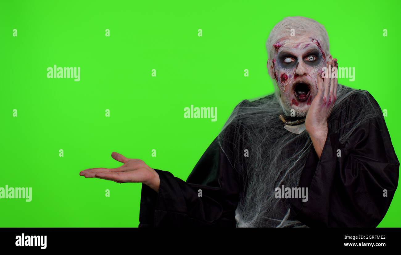 Scary wounded Halloween zombie undead man showing thumbs up and ...