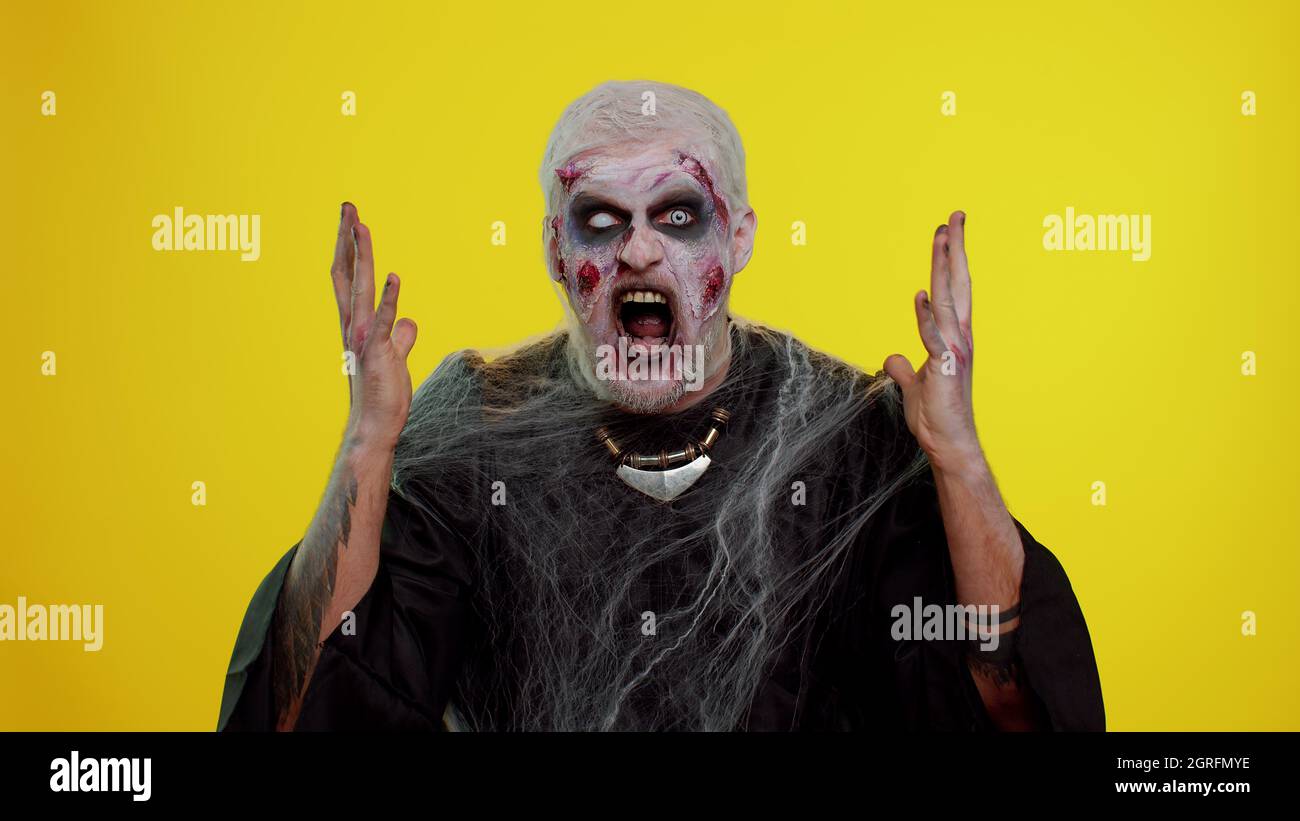 Dissatisfied Halloween zombie man asking reason of failure feeling ...
