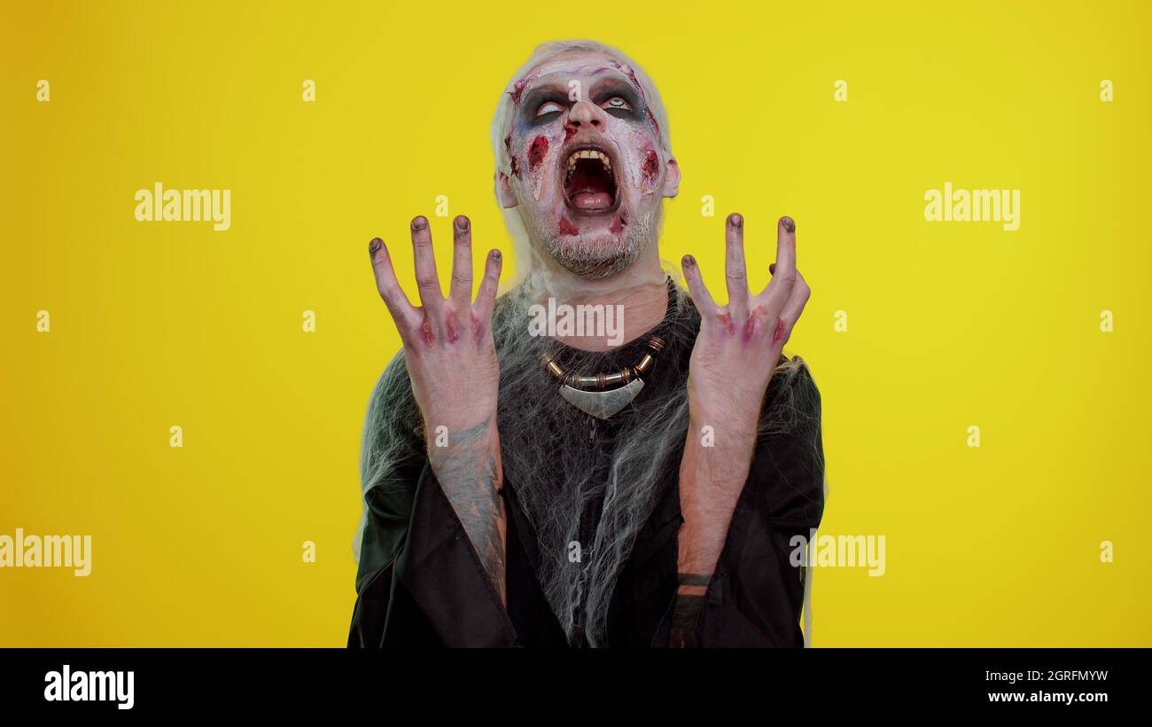 Spooky Halloween zombie man asking reason of failure feeling bored ...