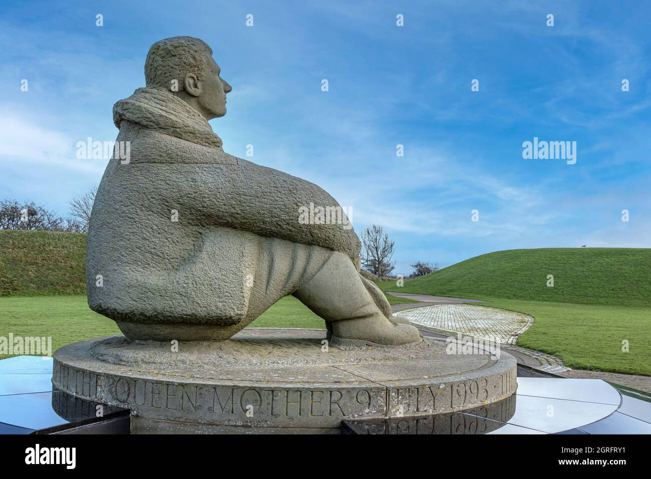 The carved statue of a young pilot looking out over the English Channel ...