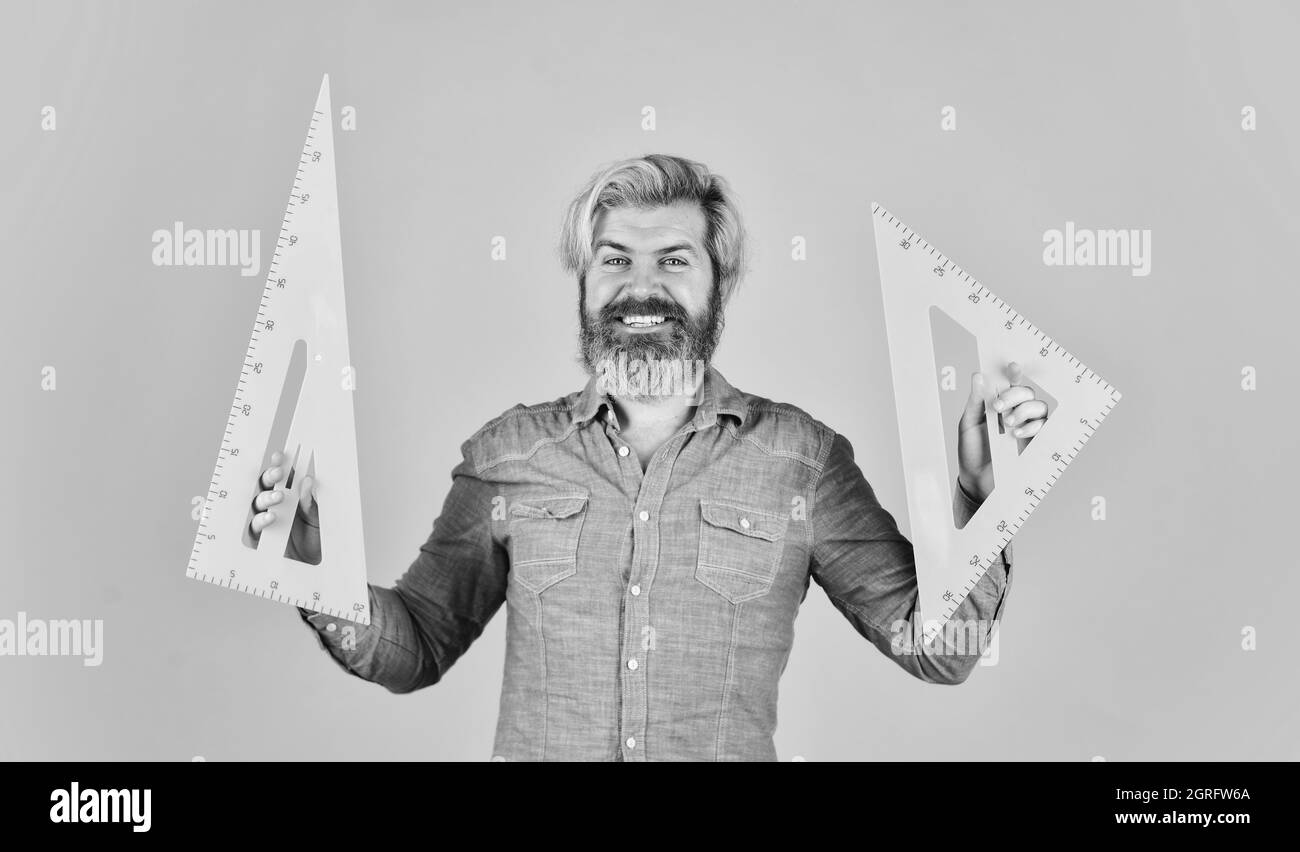 Teaching geometry. Bearded man teacher use ruler. Right angle ...