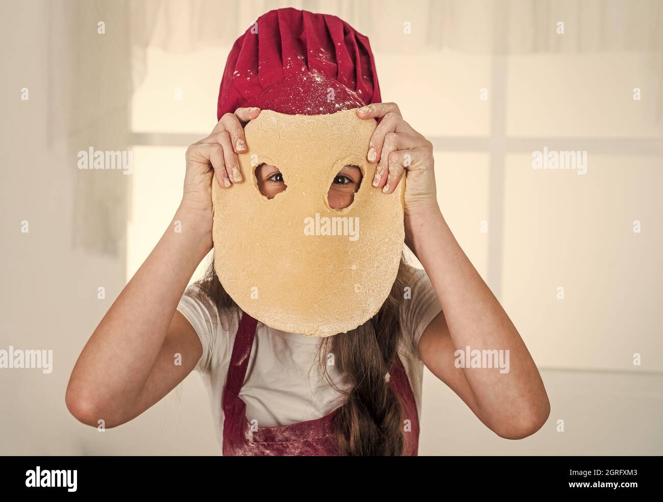 girl having fun while cooking, funny face Stock Photo - Alamy