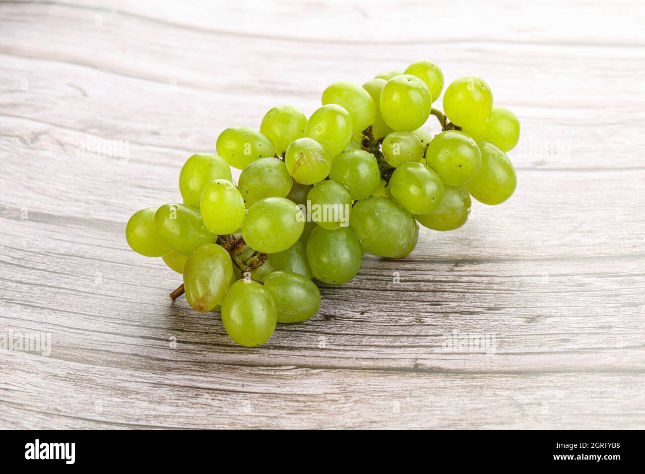 Ripe sweet green grape branch isolated Stock Photo - Alamy