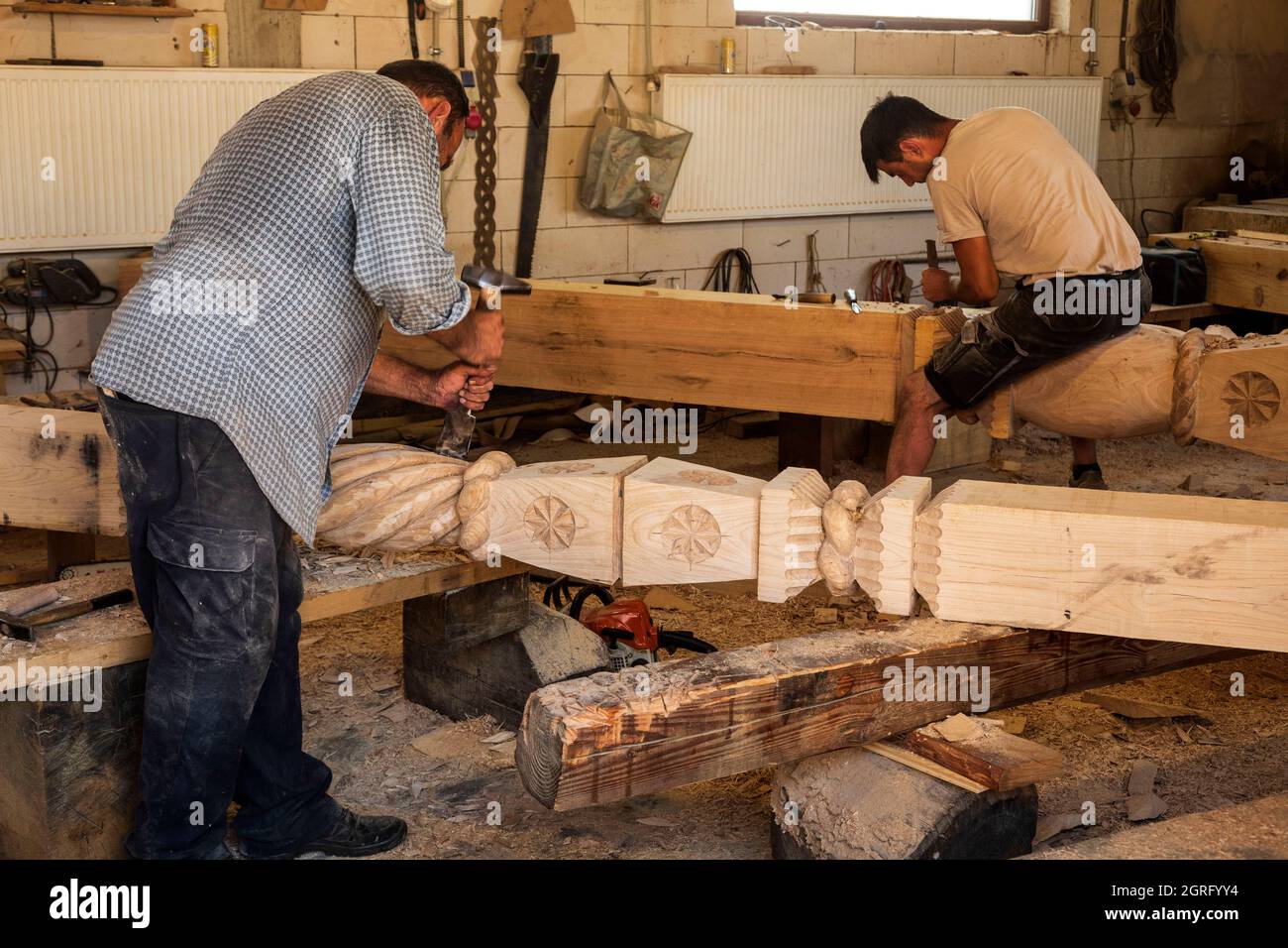 Romania, Maramures region, Barsana, carpenter, creation of crosses and ...