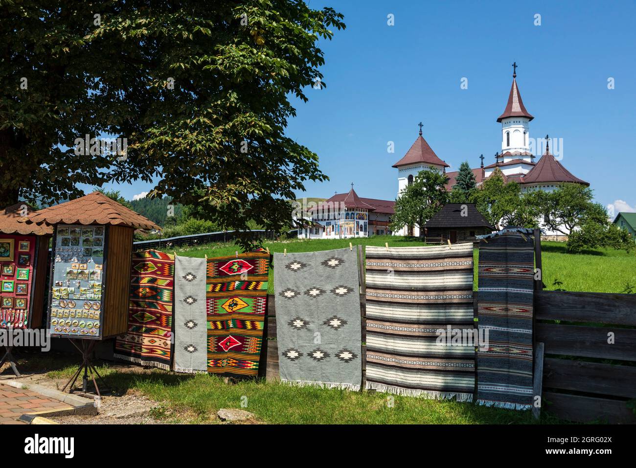 Romania, Bucovina, Humorului, Orthodox Church, sale of traditional rugs ...