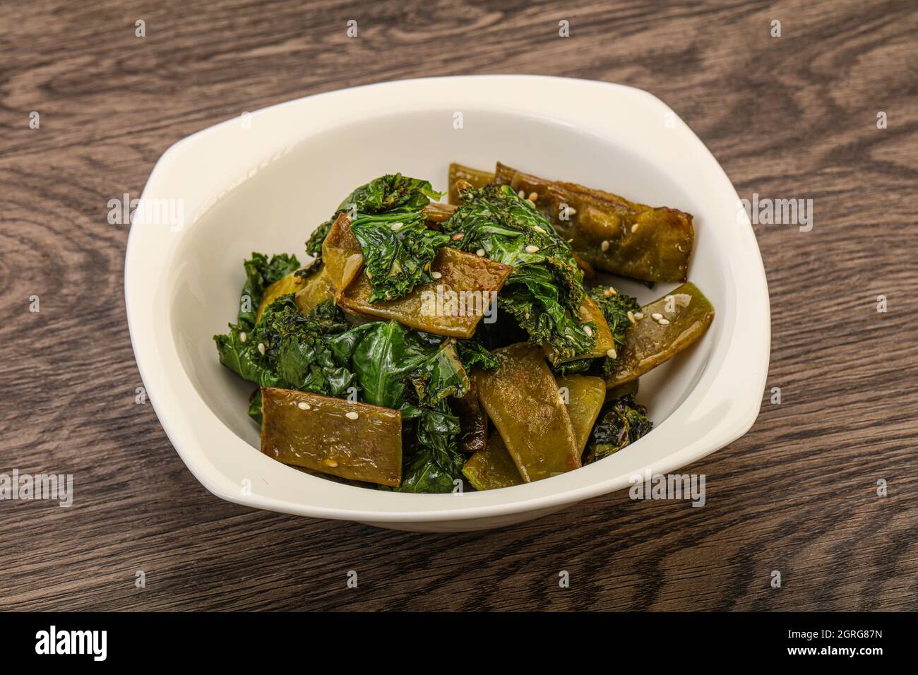 Vagan cuisine with roasted green bean and cabbage Stock Photo - Alamy