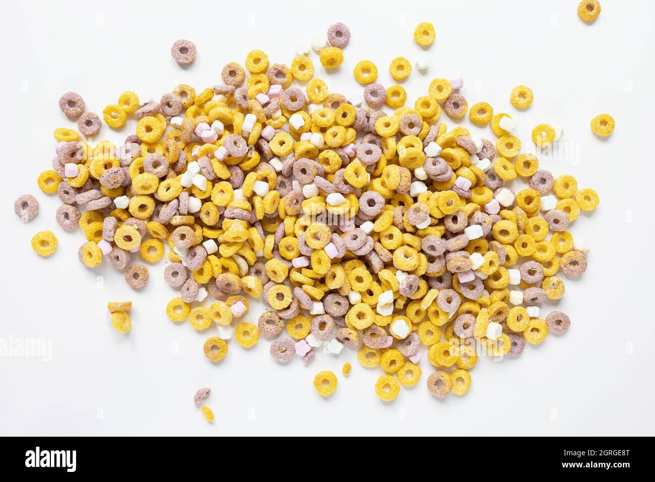 Multi colored cereal fruit loops on white background. Close up ...