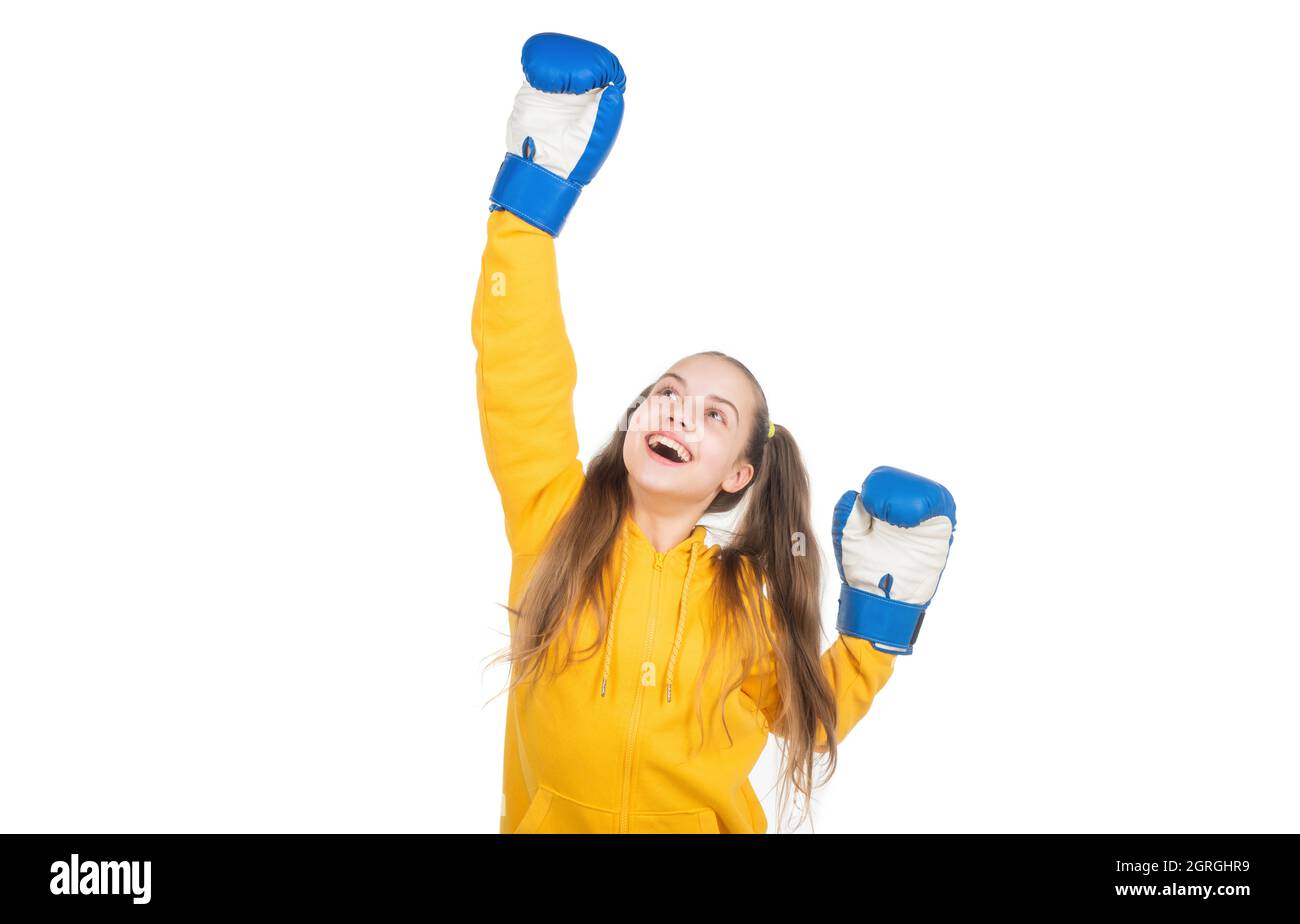 she is champion. winner of fight. teen girl in boxing gloves ...
