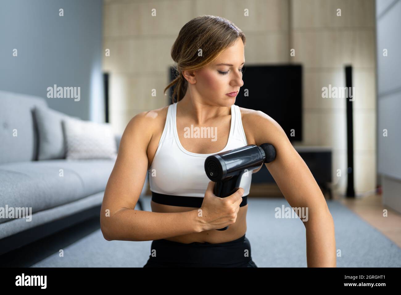 Massage Gun Machine For Muscle Recovery Therapy Stock Photo - Alamy