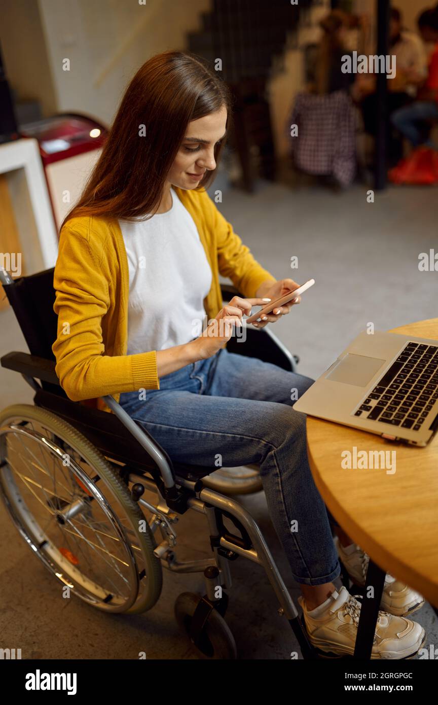 Girl wheelchair mobile phone hi-res stock photography and images - Alamy