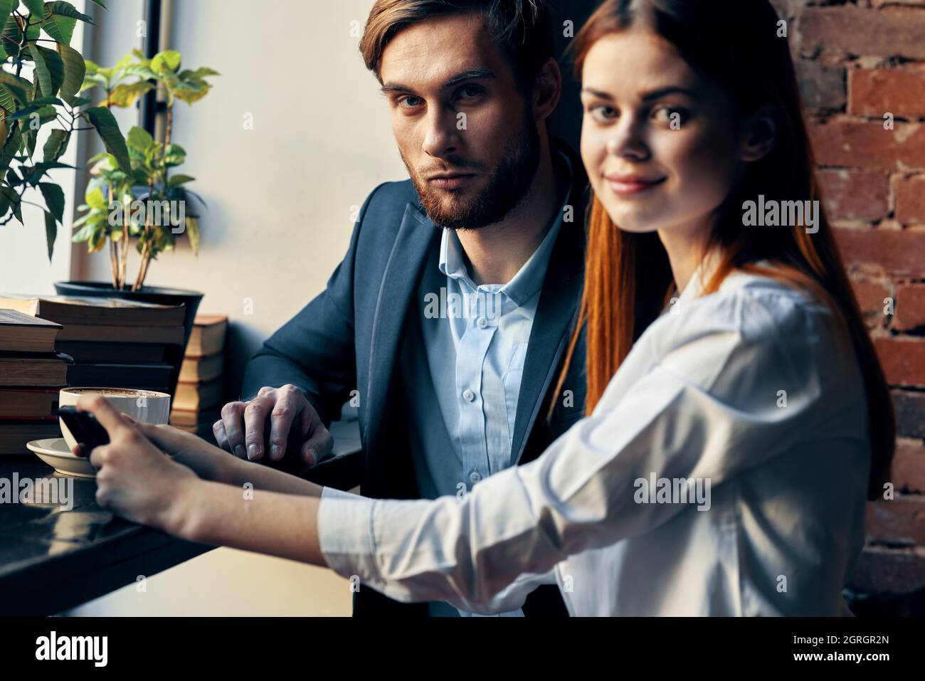 business man and woman in a cafe communication professionals Stock ...