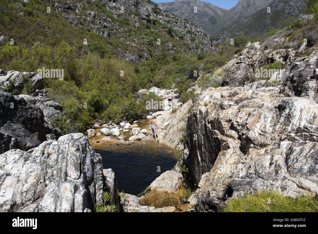 Two men on river rocks two men on river rocks hi-res stock photography ...