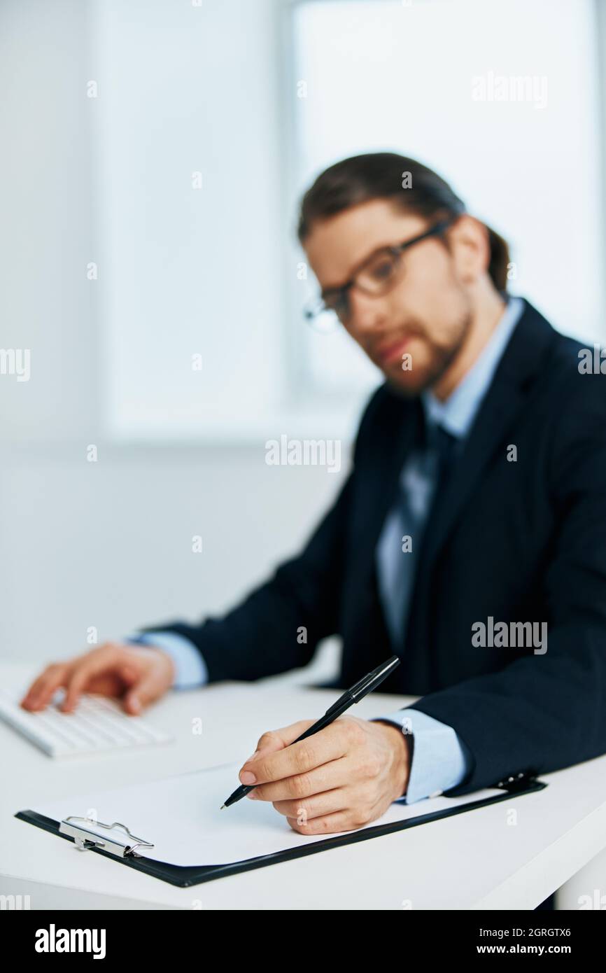 male manager with glasses work desk documents work Stock Photo - Alamy