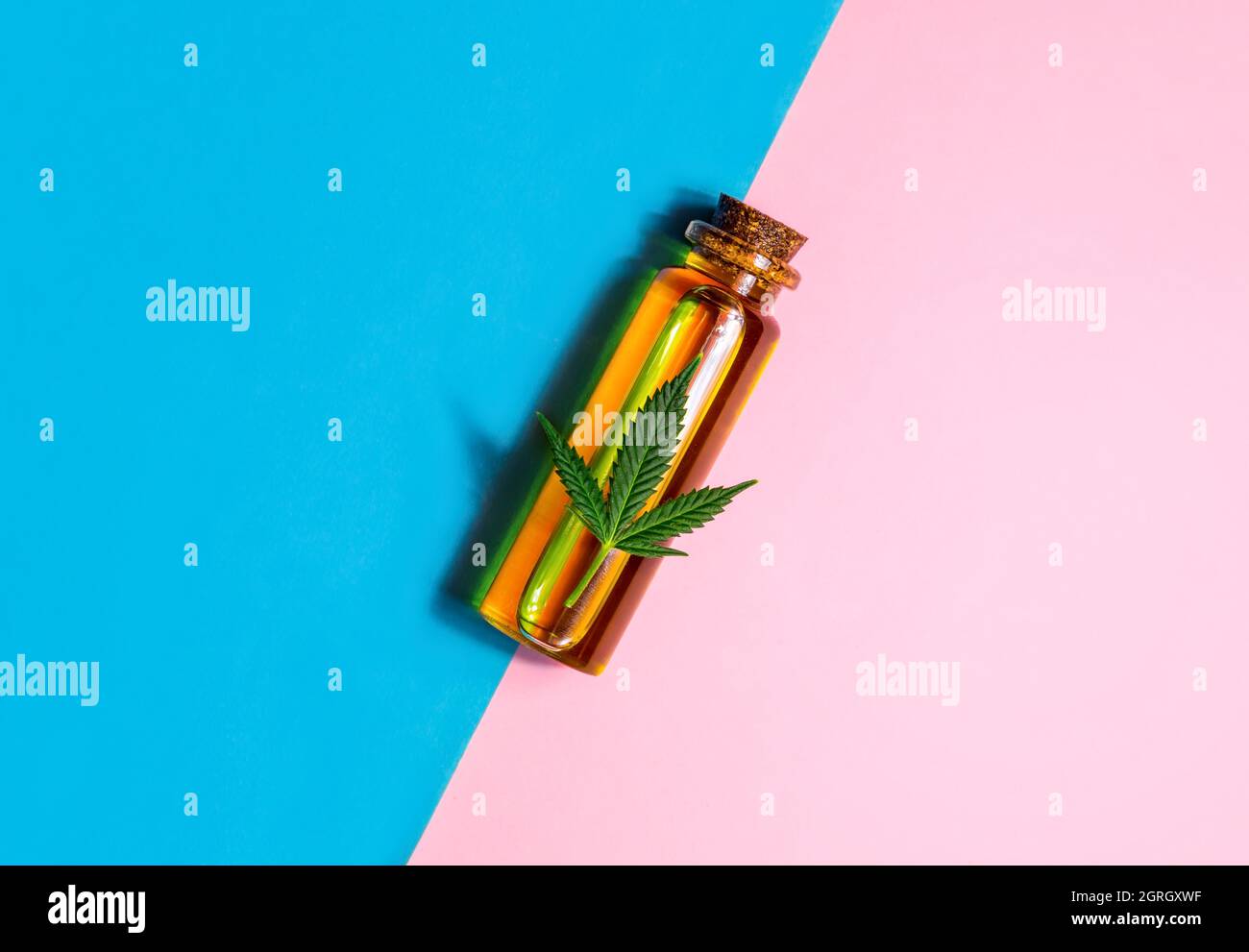Medical CBD Cannabis oil on glass bottle with Marijuana leaf on pastel ...