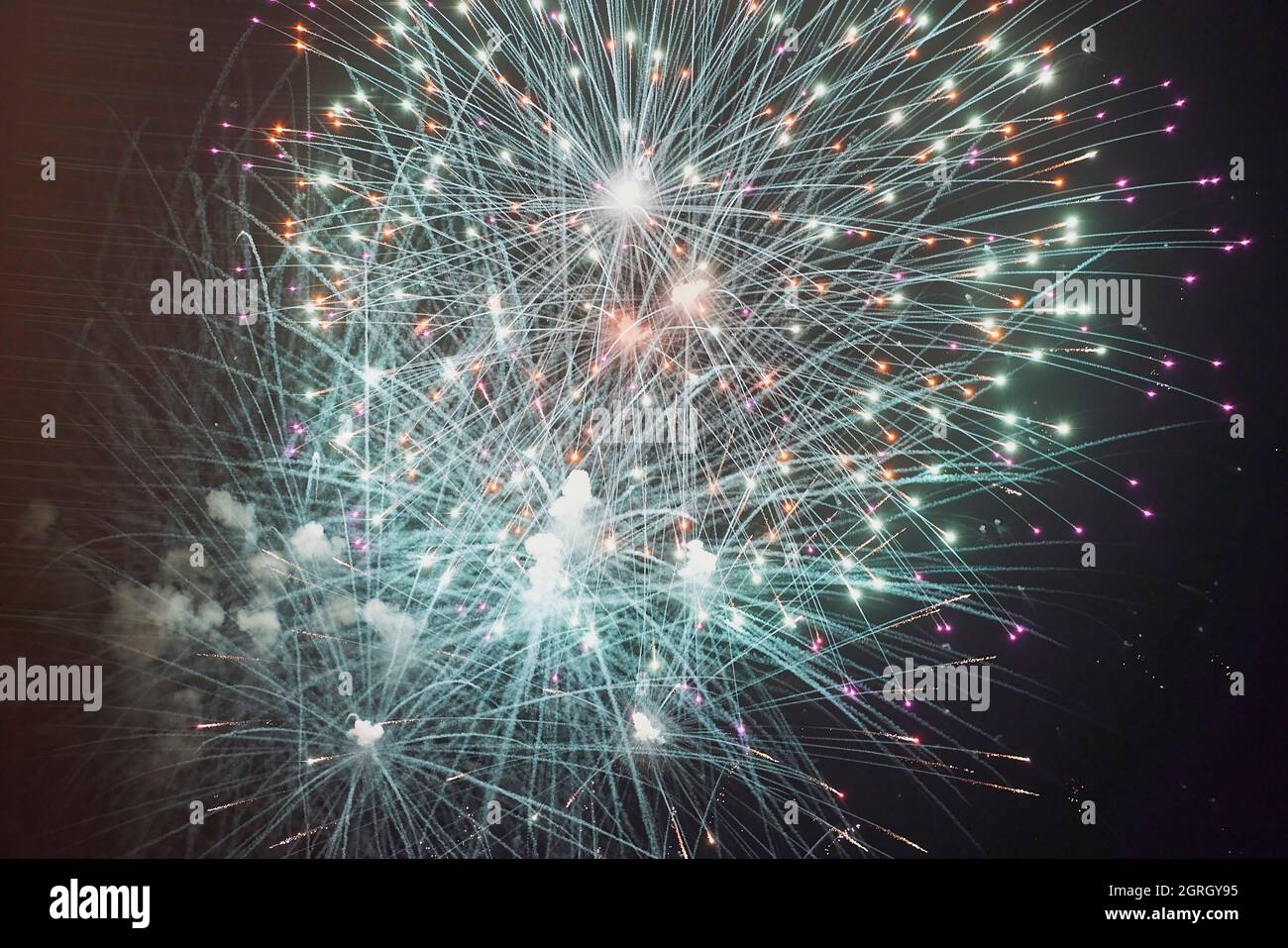 Low angle view of fireworks exploding against sky at night, Toledo ...