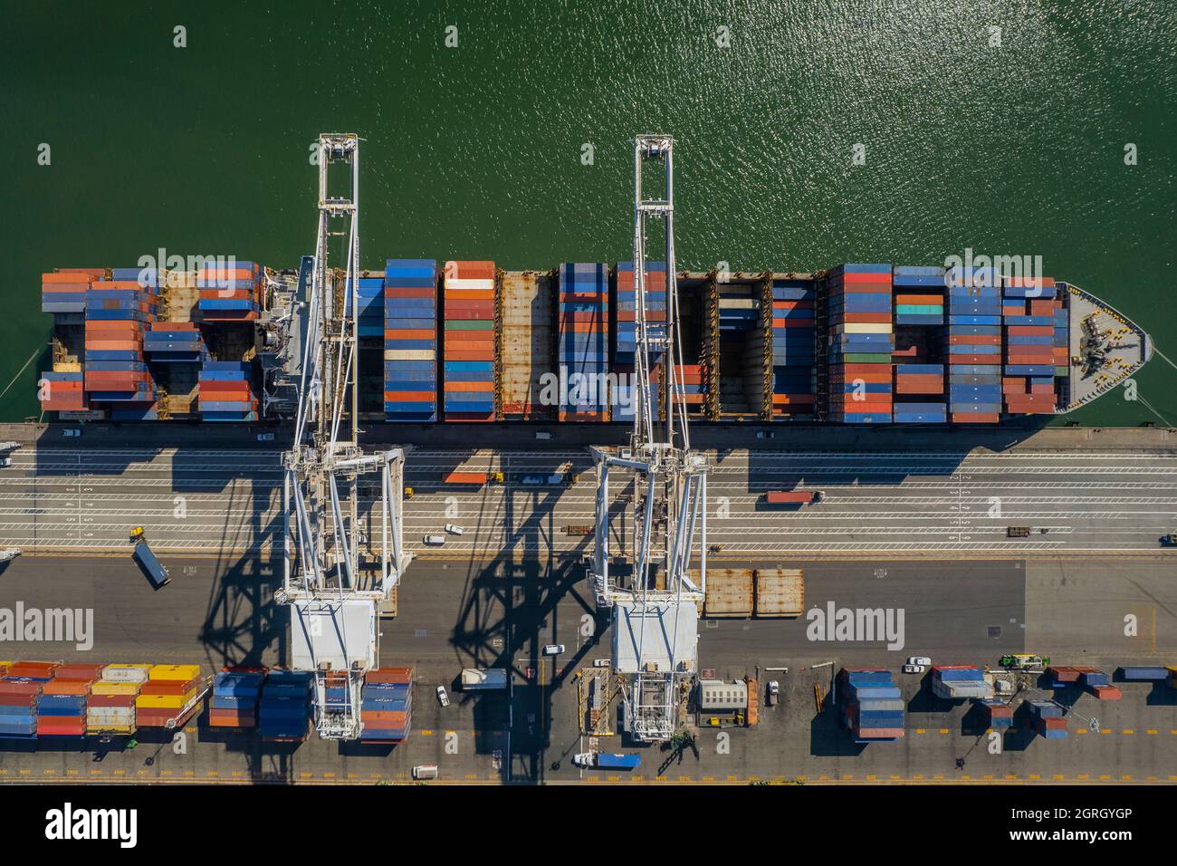 Aerial view of a cargo ship loading at the port Stock Photo - Alamy