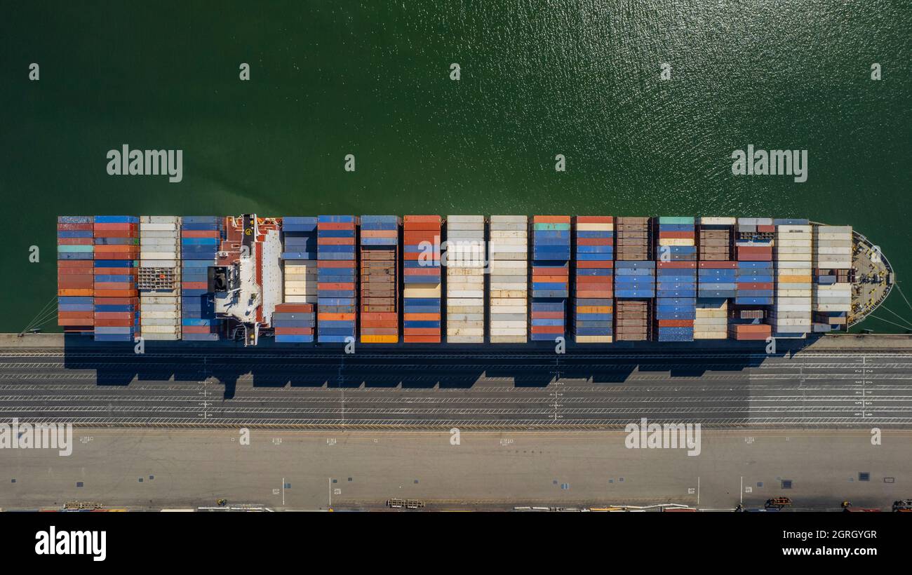 Aerial view of a fully loaded cargo ship docked at a port Stock Photo ...