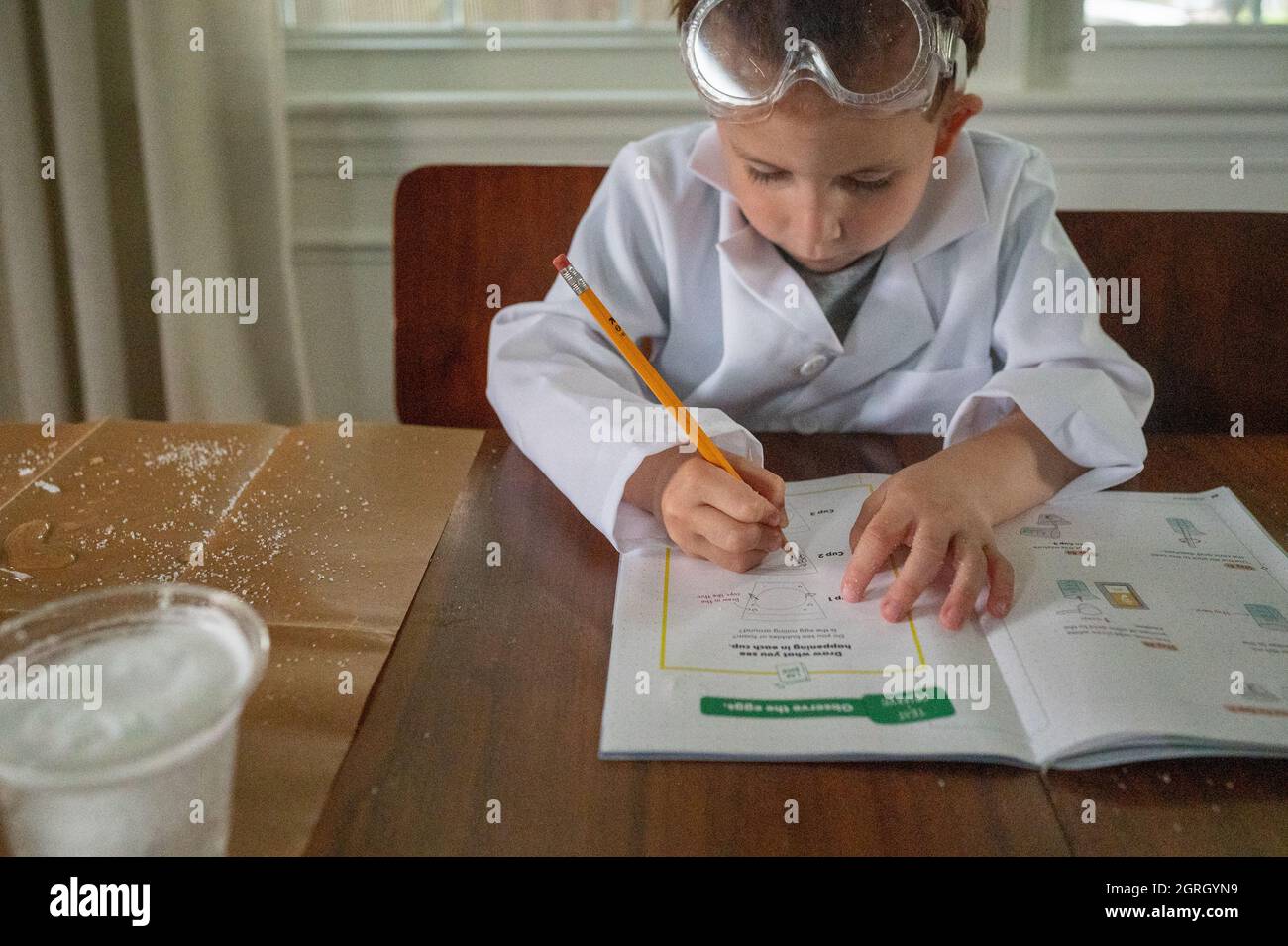Boy writing notes hi-res stock photography and images - Alamy