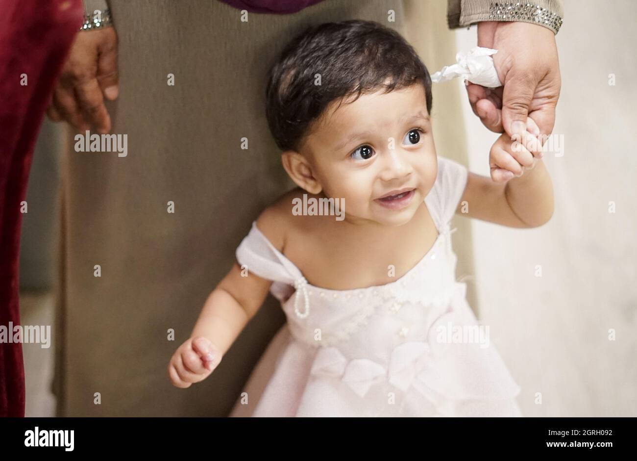DHAKA, BANGLADESH - Sep 11, 2021: A cute happy girl baby on her birthday in Dhaka, Bangladesh ...