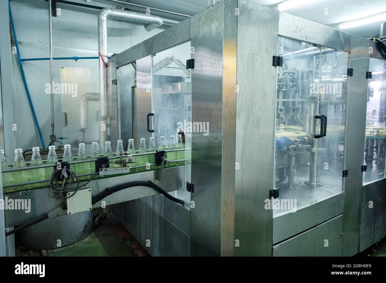 Beverage bottling room with automatic machinery and control panel in ...