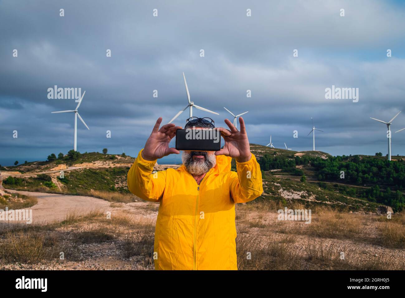 Man walking wind turbine hi-res stock photography and images - Alamy