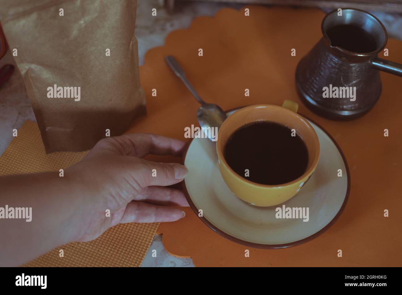 Hand taking coffee cup hi-res stock photography and images - Alamy