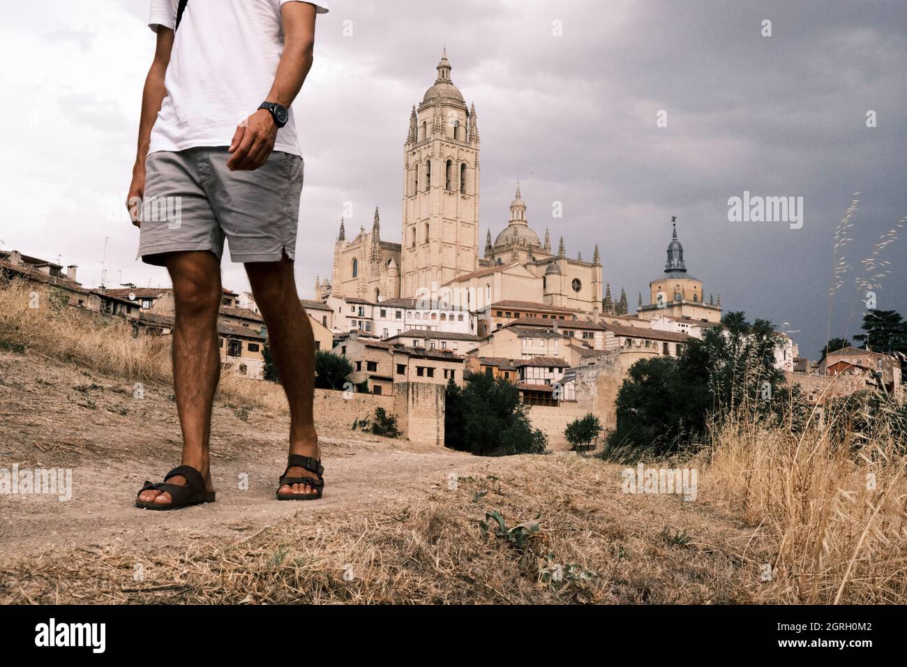 the legs of a pilgrim on sandals and the shell signal in an ancient ...