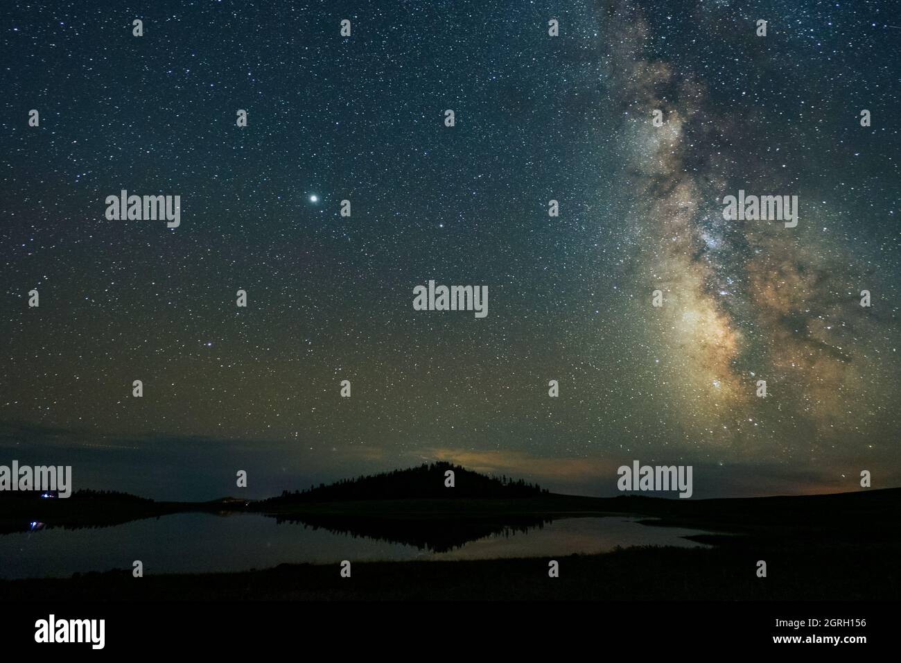 Beautiful starry night sky above a lake and landsc Stock Photo - Alamy