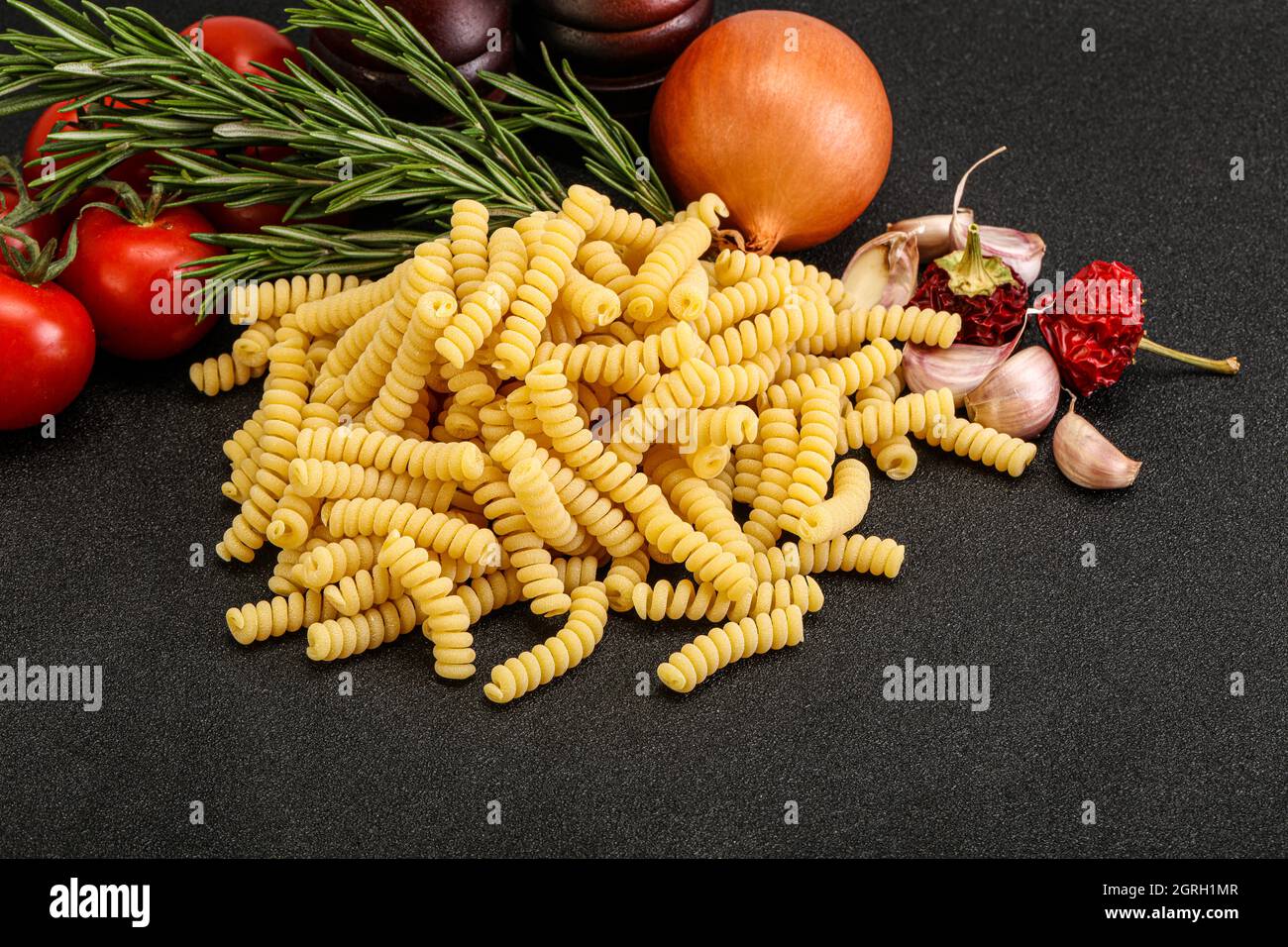 Raw Italian wheat pasta - Fusilli for cooking Stock Photo - Alamy