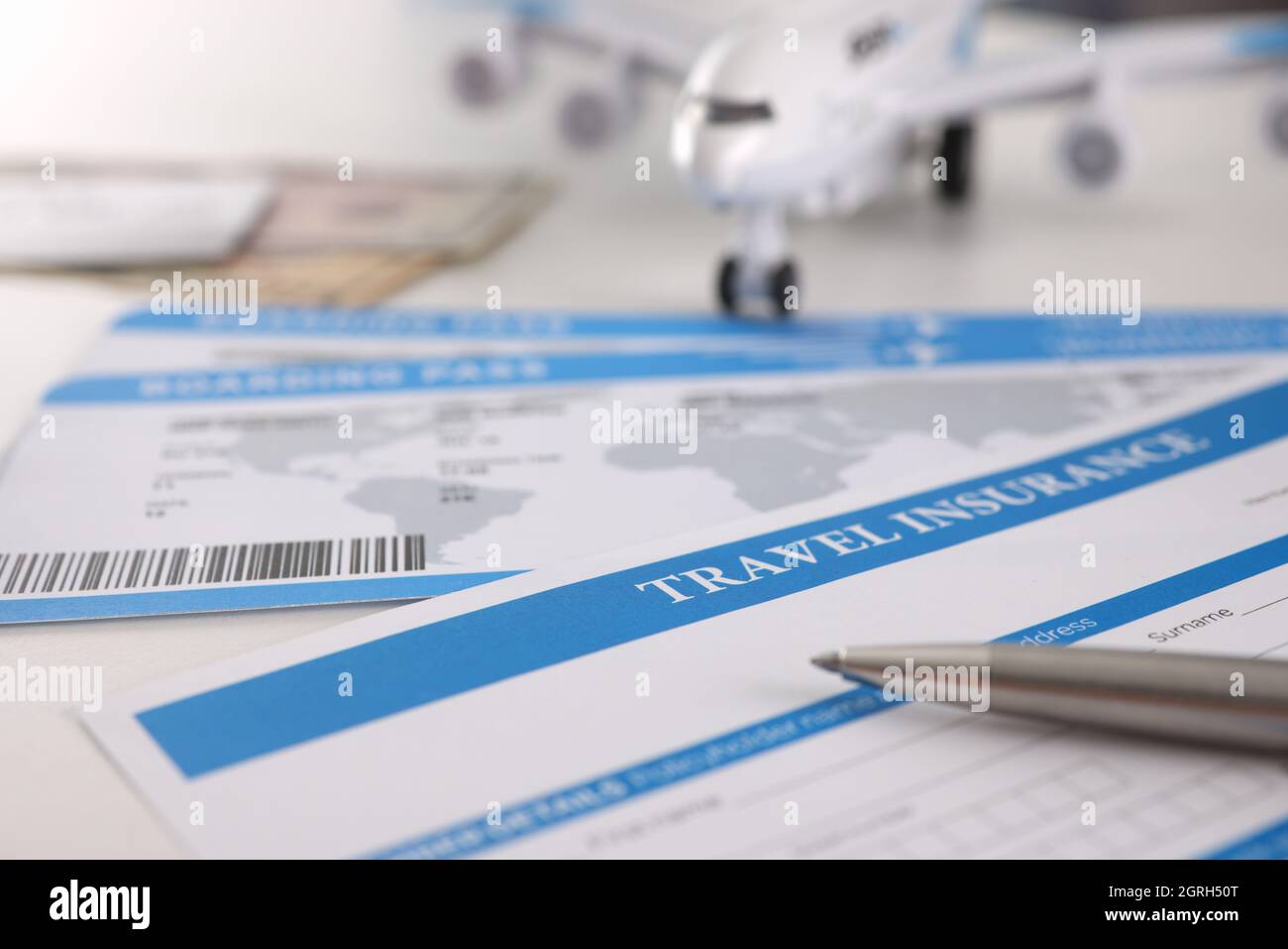 Medical insurance contract for tourists pen and plane on table Stock ...